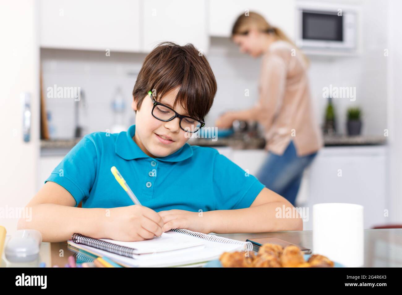 Boy doing homework mother hi-res stock photography and images - Alamy