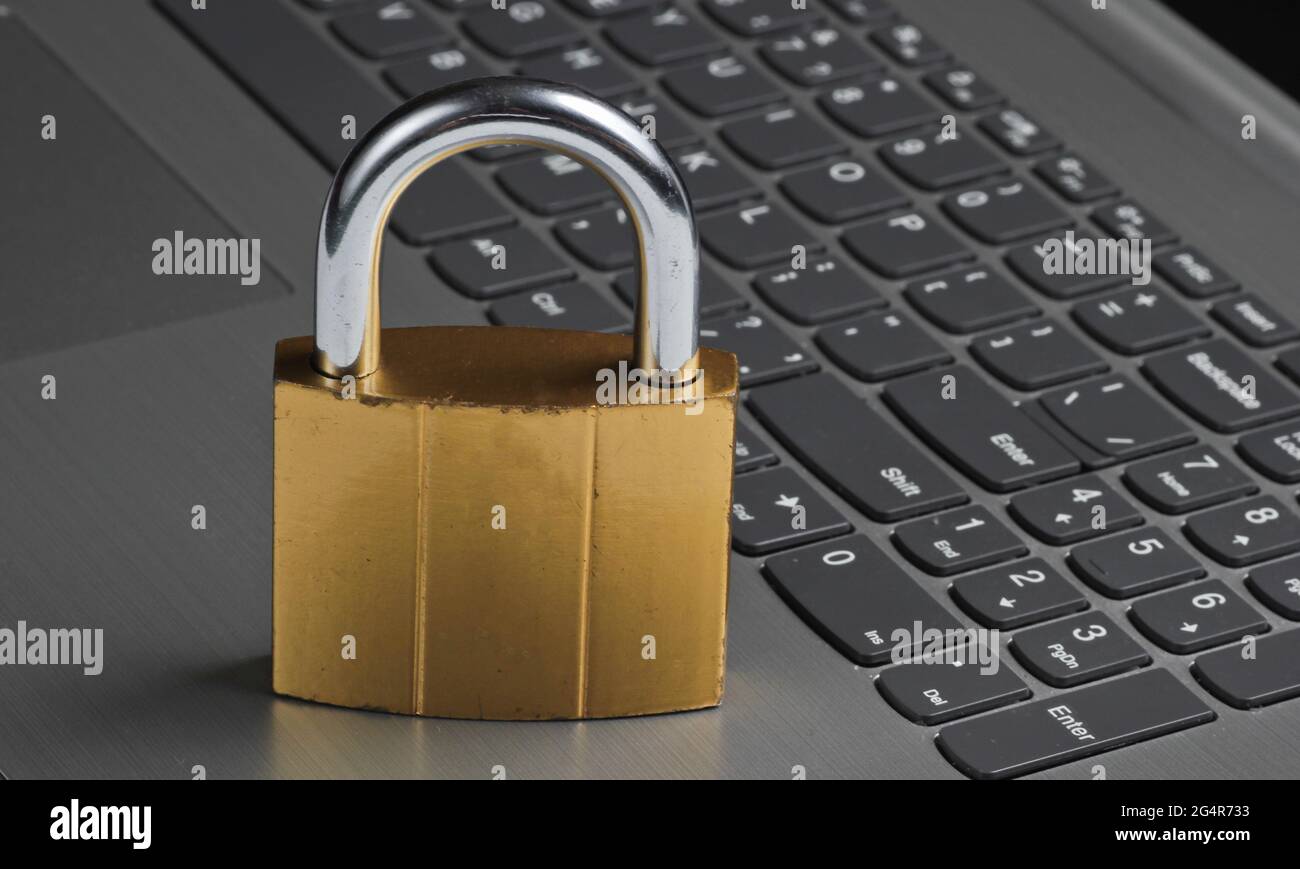Computer protection concept, internet security. Lock on keyboard laptop ...