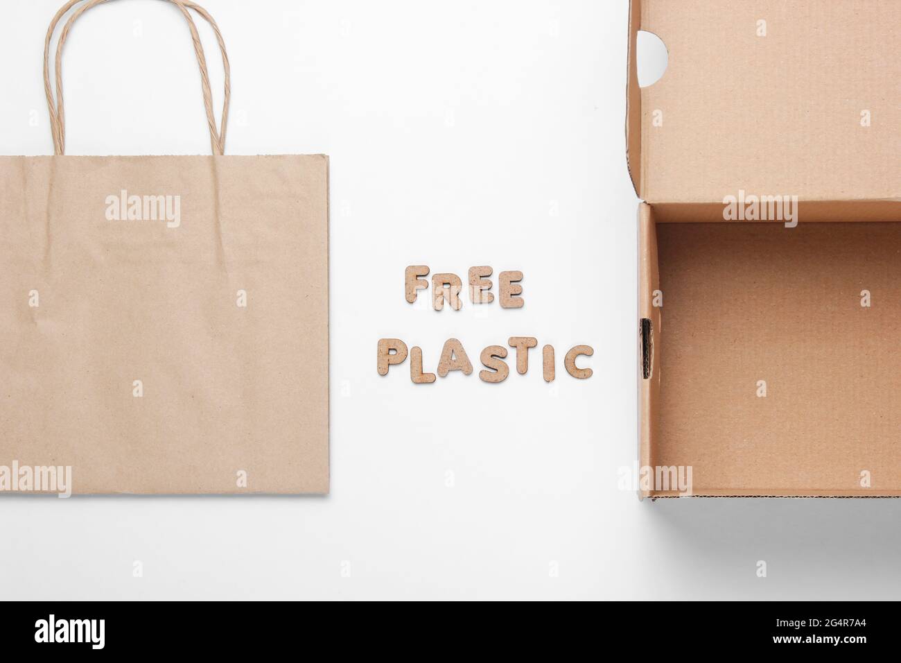 Ecological concept. Empty cardboard box, paper bag on a white ...