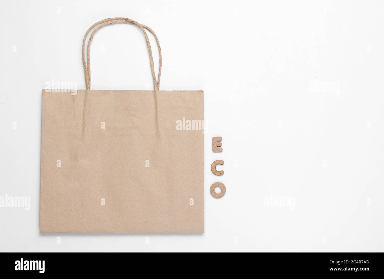 Ecological concept. Paper bag on white background with word eco. Top ...
