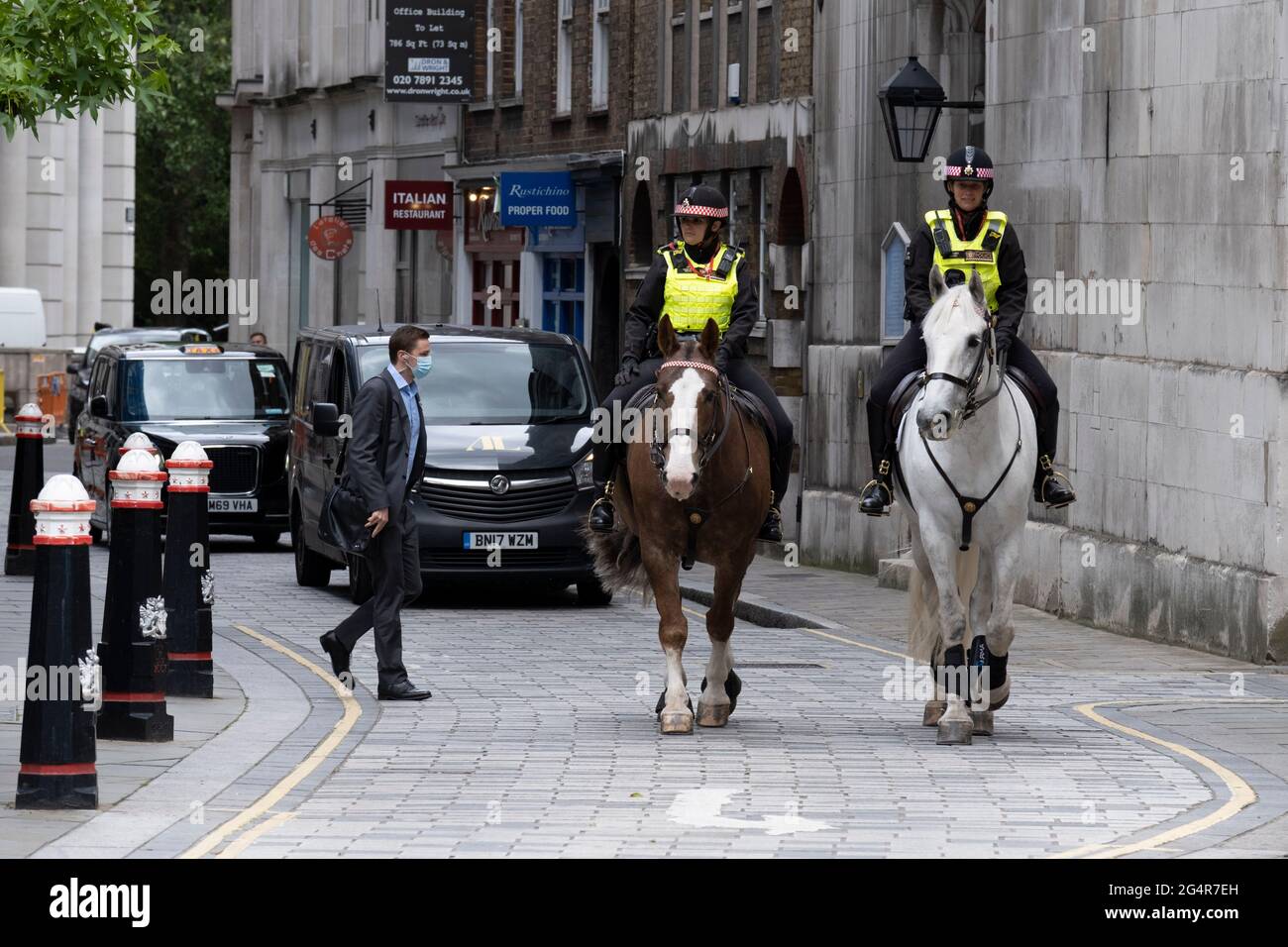 Two Women Officers with the City of London Police, ride their horses on ...