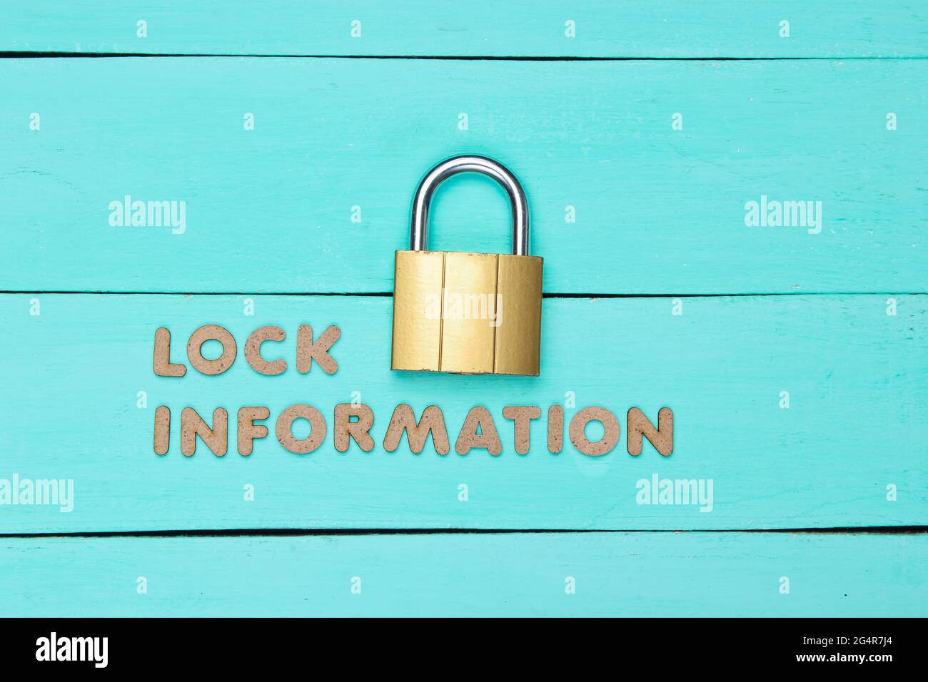 Lock your information. Lock on blue wooden background. Minimalistic ...