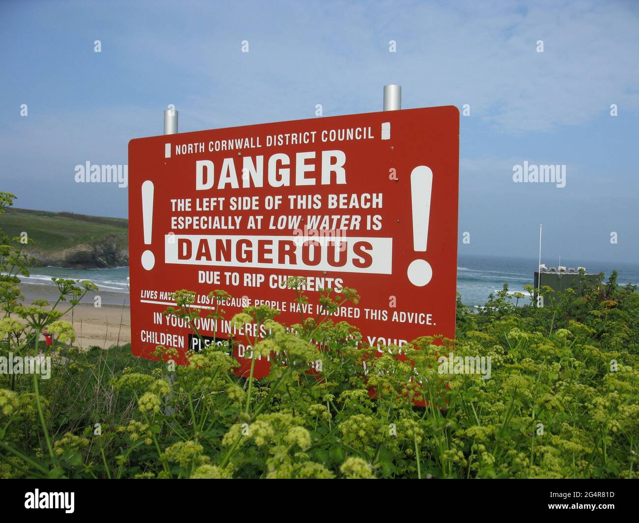 red Danger Dangerous rip currents beach sign. South west coast path ...