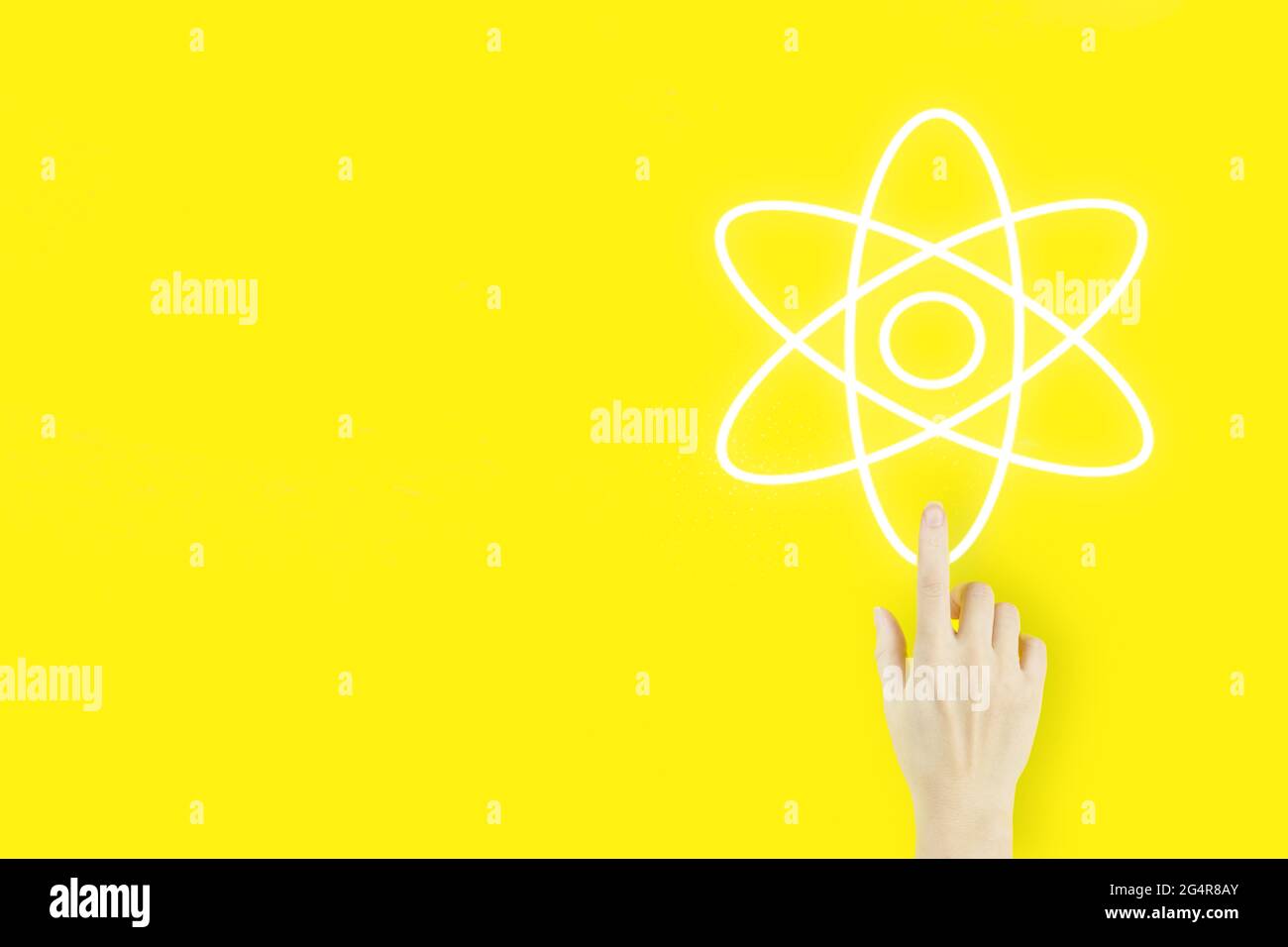 Young woman's hand pointing finger with hologram molecule atom symbol ...