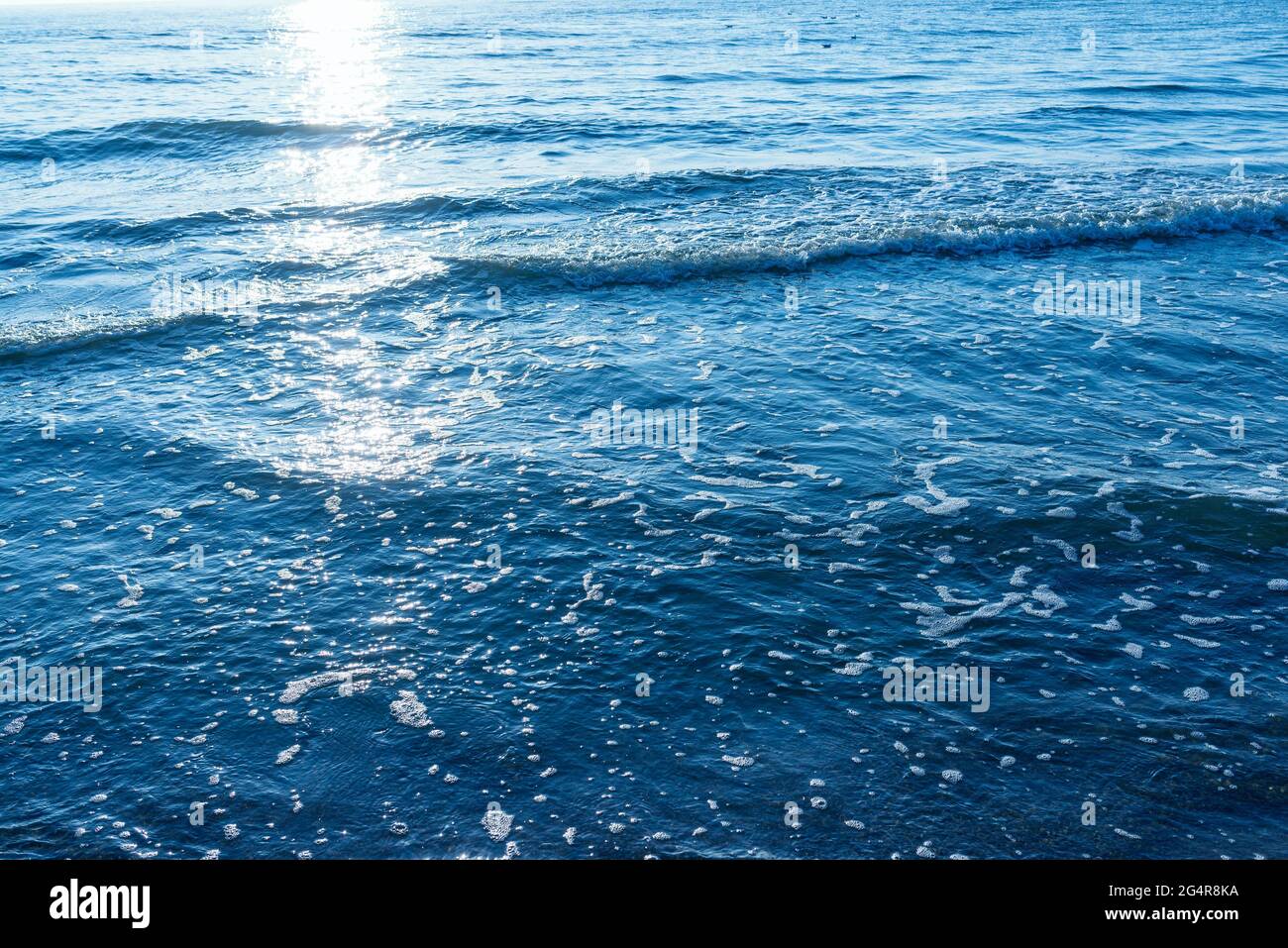 Areal shot of deep blue and rough sea with lot of sea spray.Blue ...