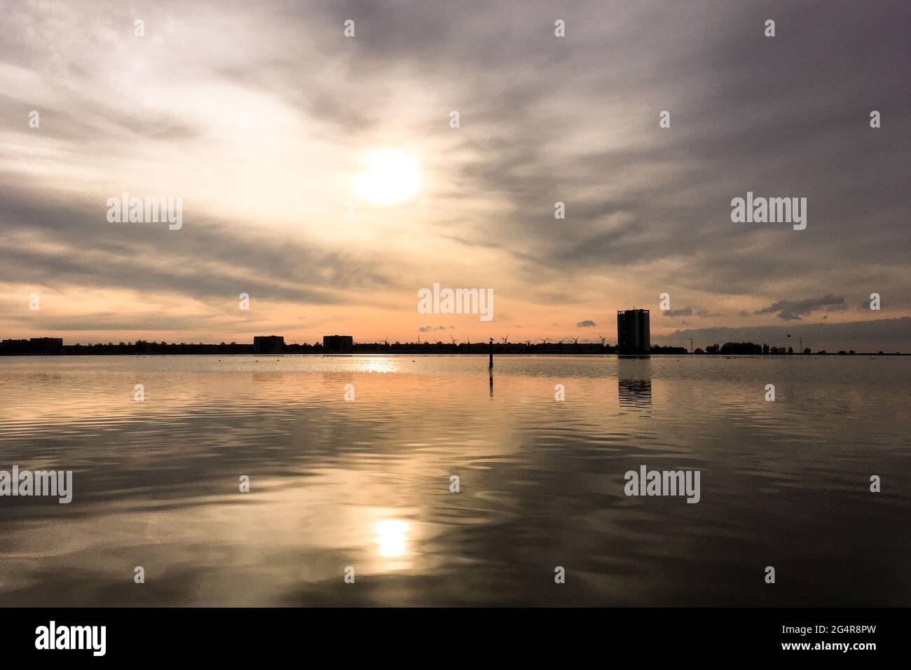 Beautiful sunset with a reflection in the water Stock Photo - Alamy