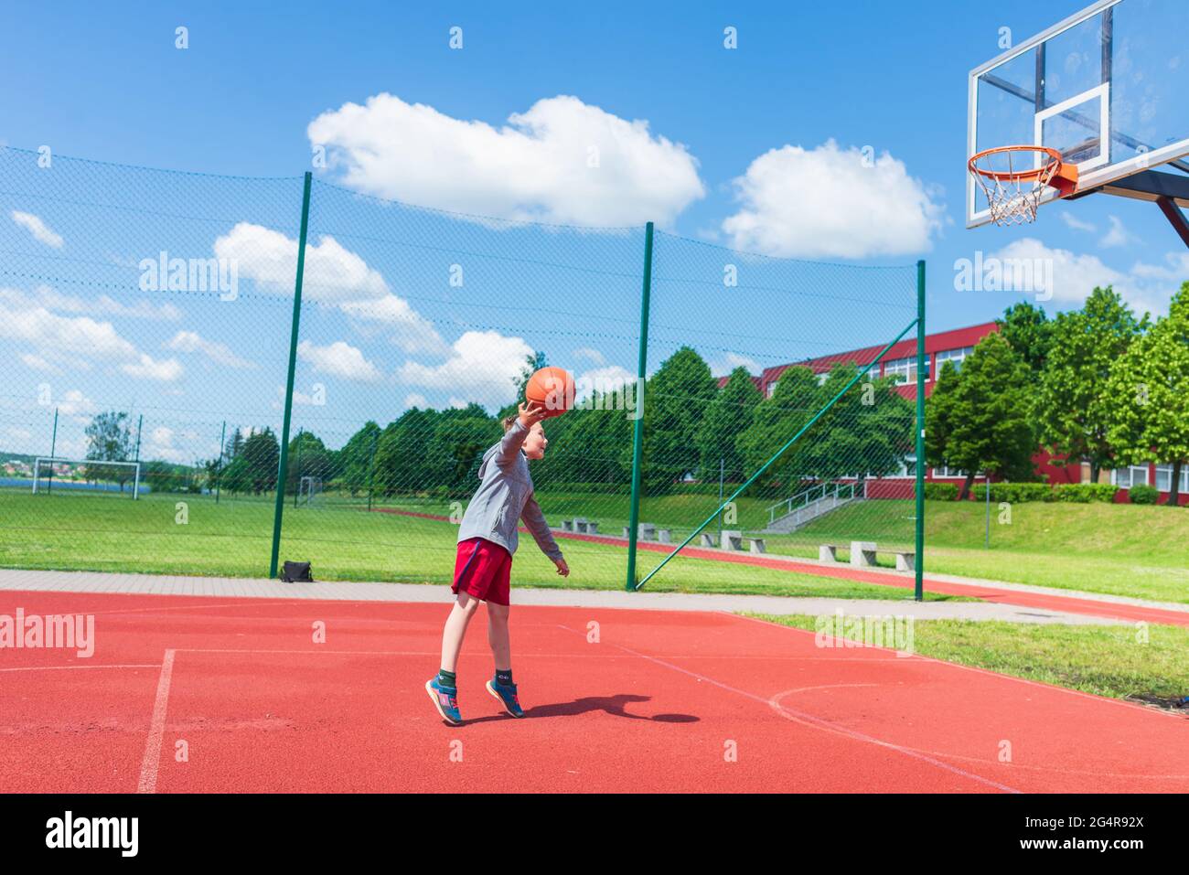 Young 10s boy having fun playing basketball outdoors.nice,cool ...