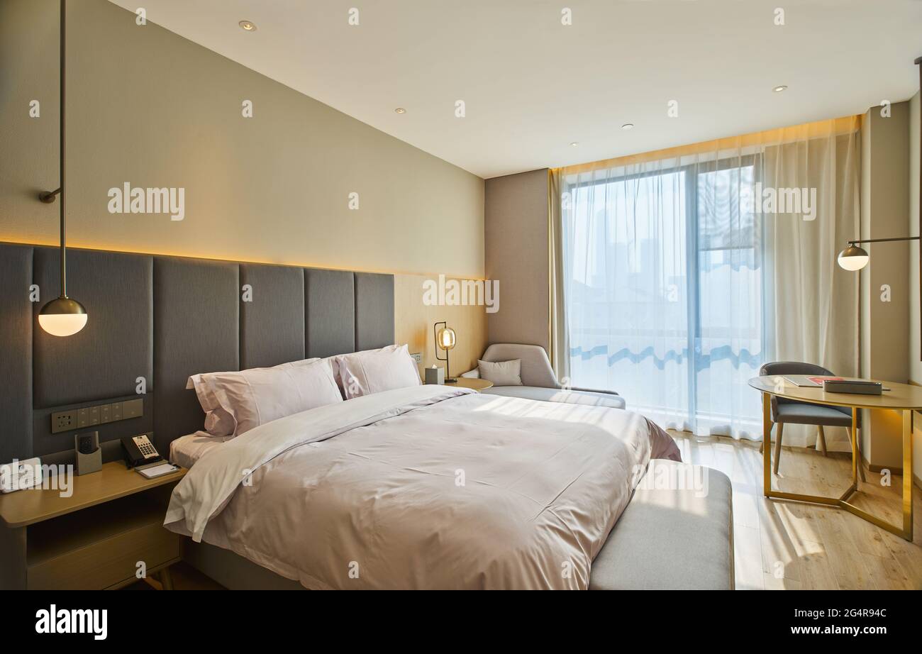 Upscale hotel guest room warm and comfortable environment Stock Photo ...