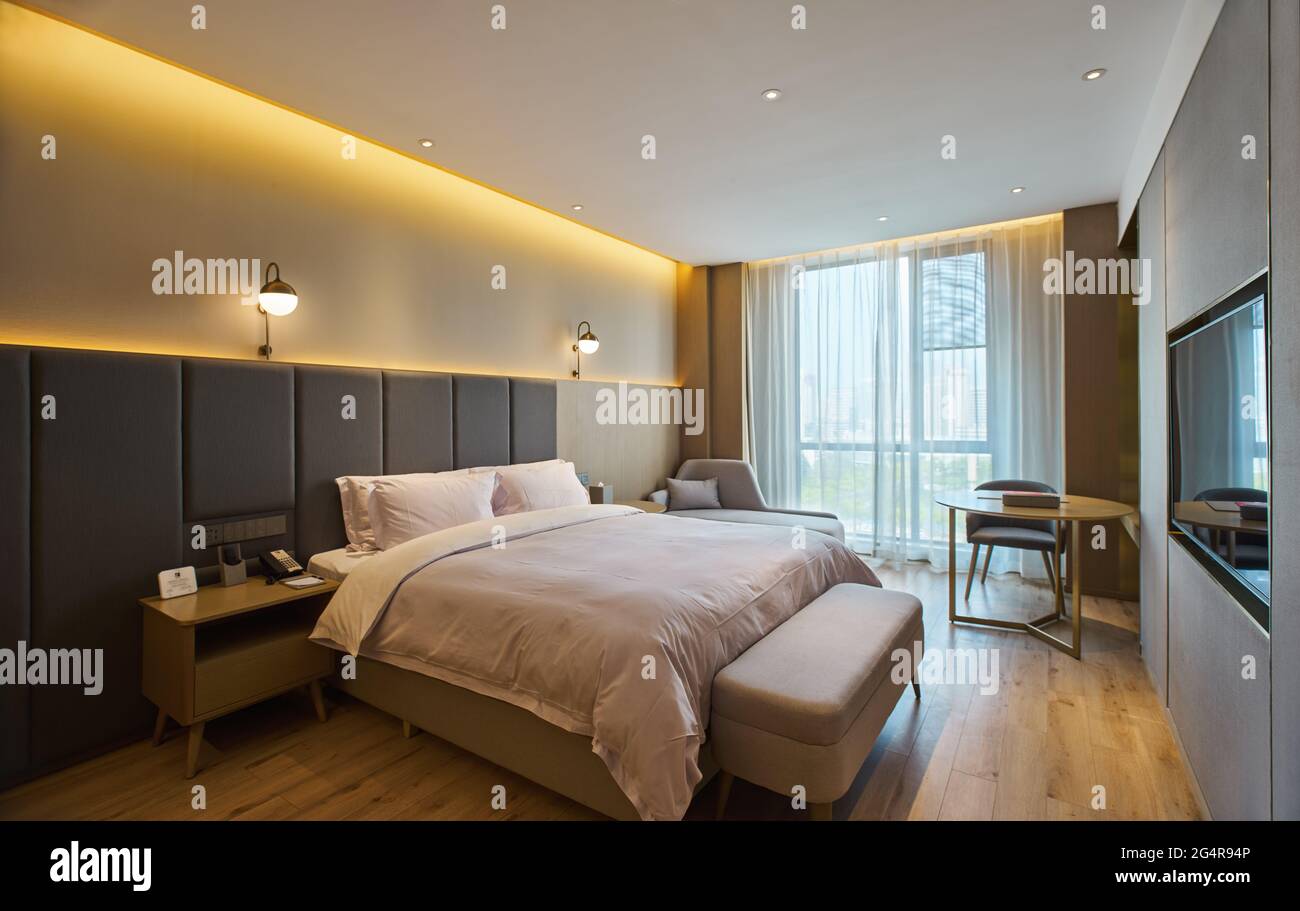 Upscale hotel guest room warm and comfortable environment Stock Photo ...