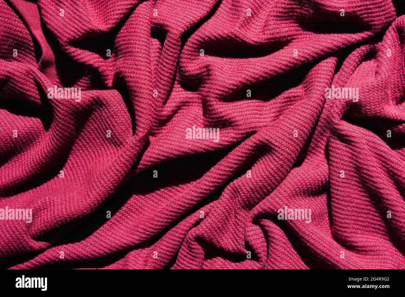 Background of crumpled red fabric texture closeup Stock Photo - Alamy