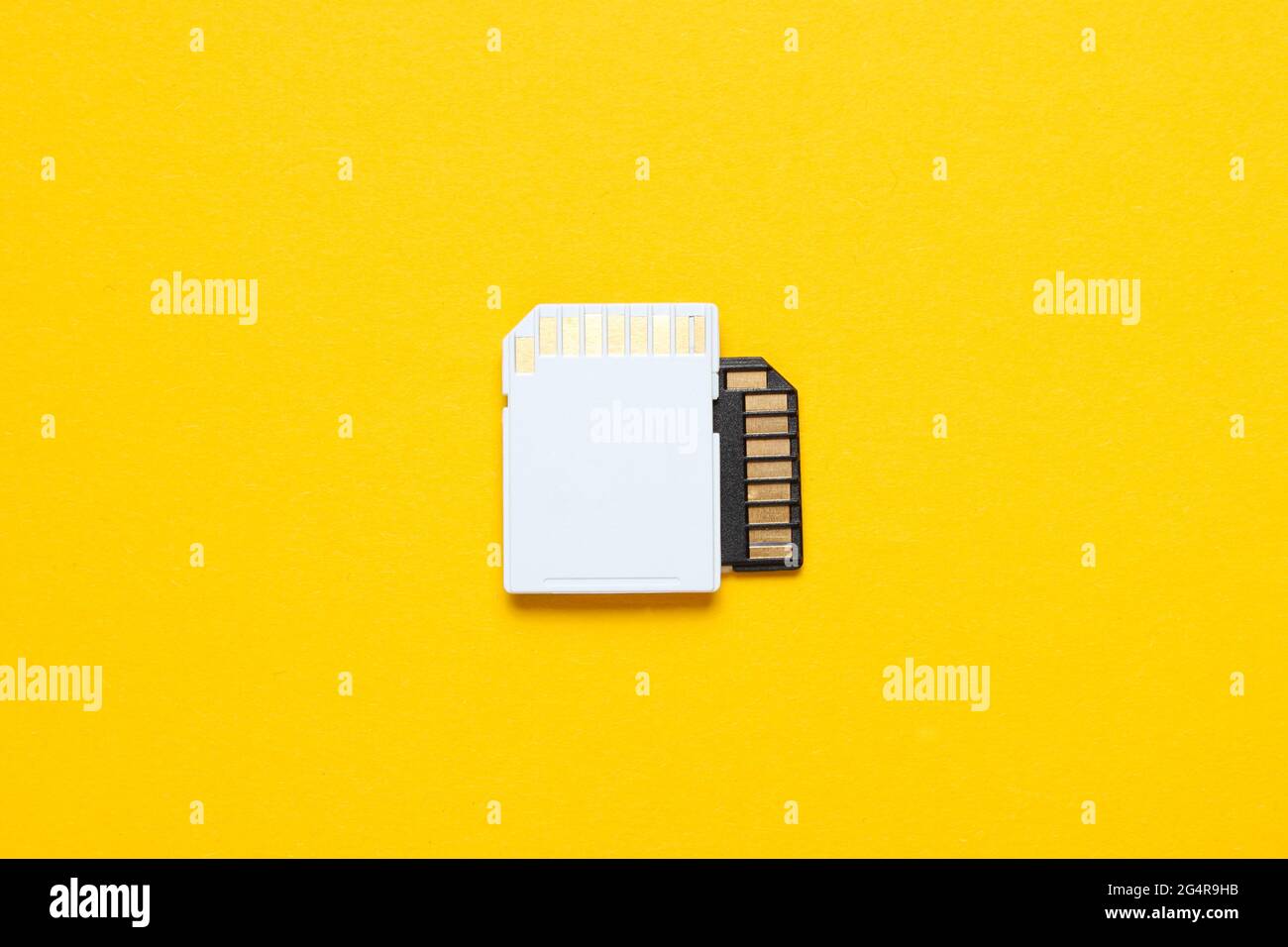 Two Mini SD memory cards on yellow background. Top view Stock Photo - Alamy
