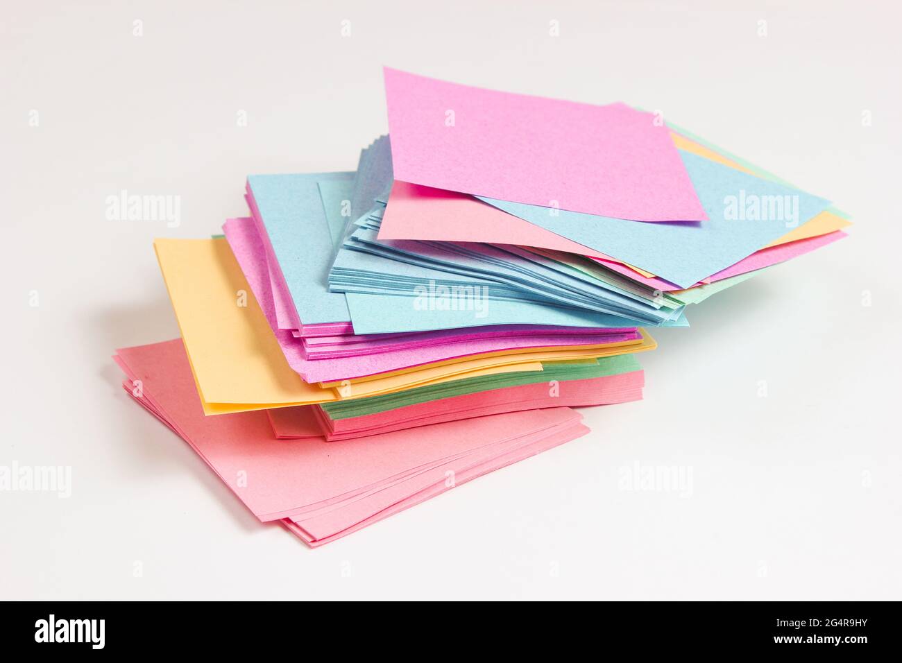 Many colored memo sheets of paper on a white background Stock Photo - Alamy
