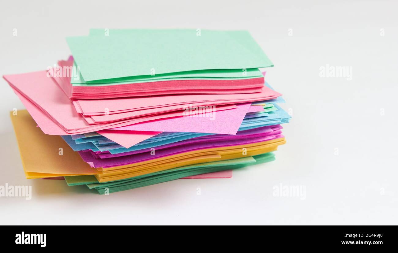Many colored memo sheets of paper on a white background Stock Photo - Alamy