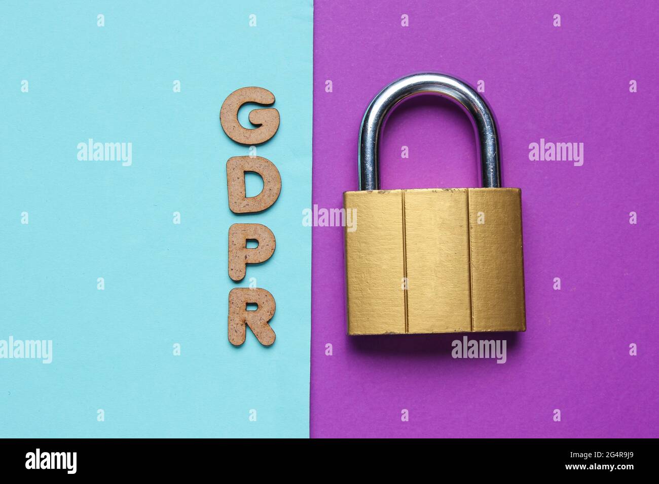 Lock and word GDPR on blue pink paper background. Top view Stock Photo ...