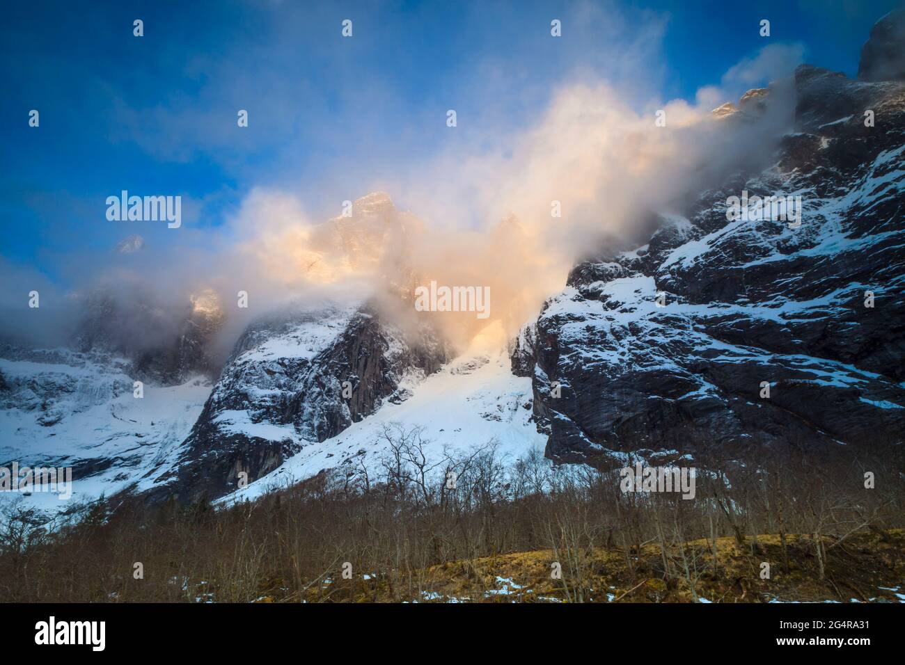 Early morning sunlight and mist on and around Trollveggen, or the Troll ...