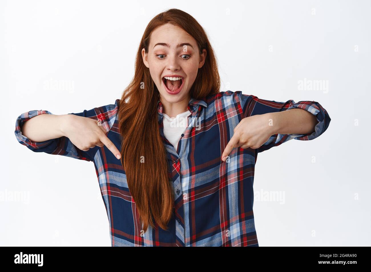 Surprised And Happy Ginger Girl Scream From Excitement Pointing And