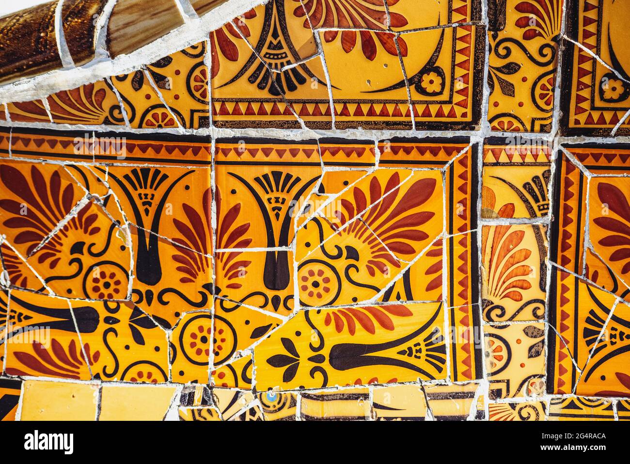 abstract ceramic mosaic tiles pattern in Barcelona park Guell. Spain ...