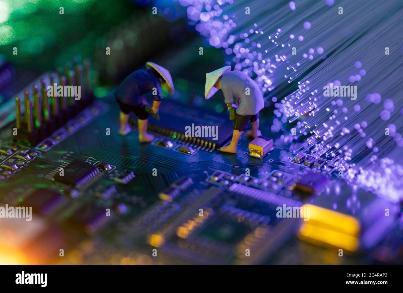 Busy workers ideas on printed circuit boards Stock Photo - Alamy
