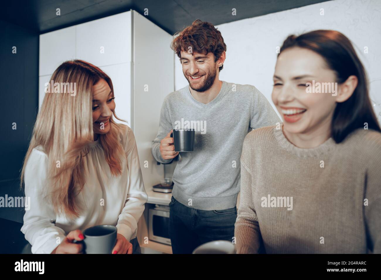 Young businesspeople colleagues having a coffee break in office ...