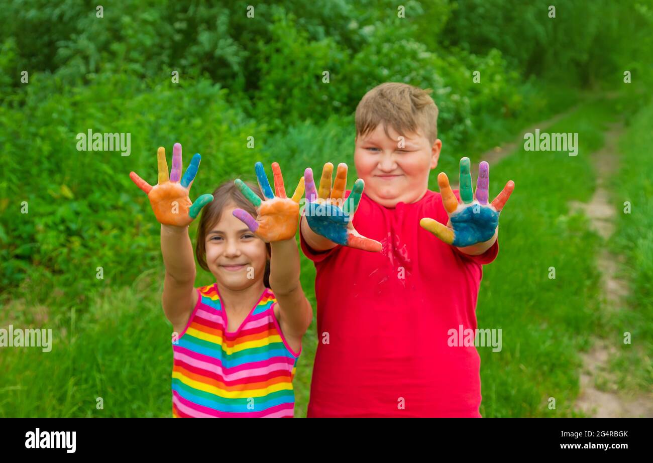 Smile on the hands of a child drawing. Selective focus. Kid Stock Photo ...