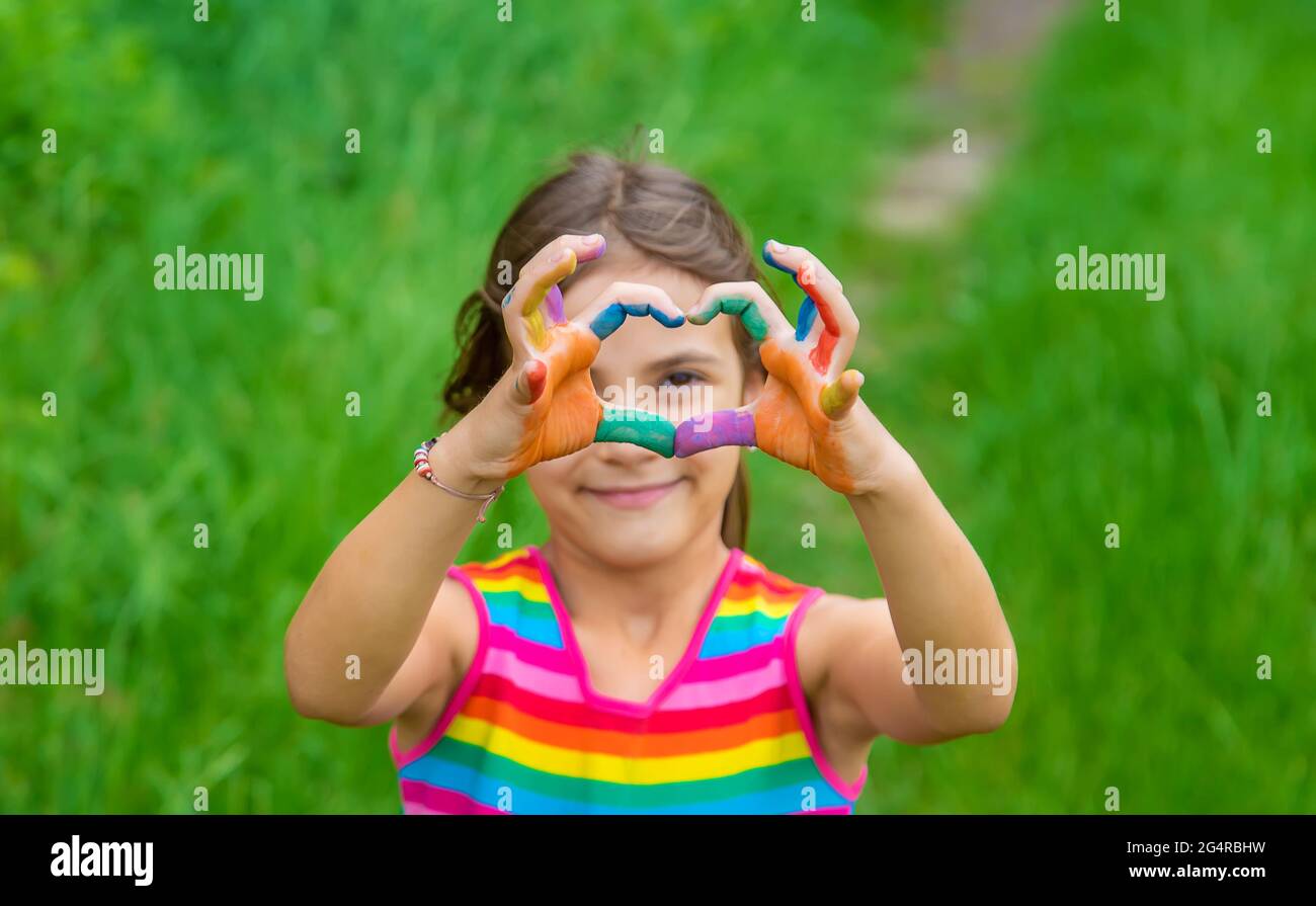 Smile on the hands of a child drawing. Selective focus. Kid Stock Photo ...