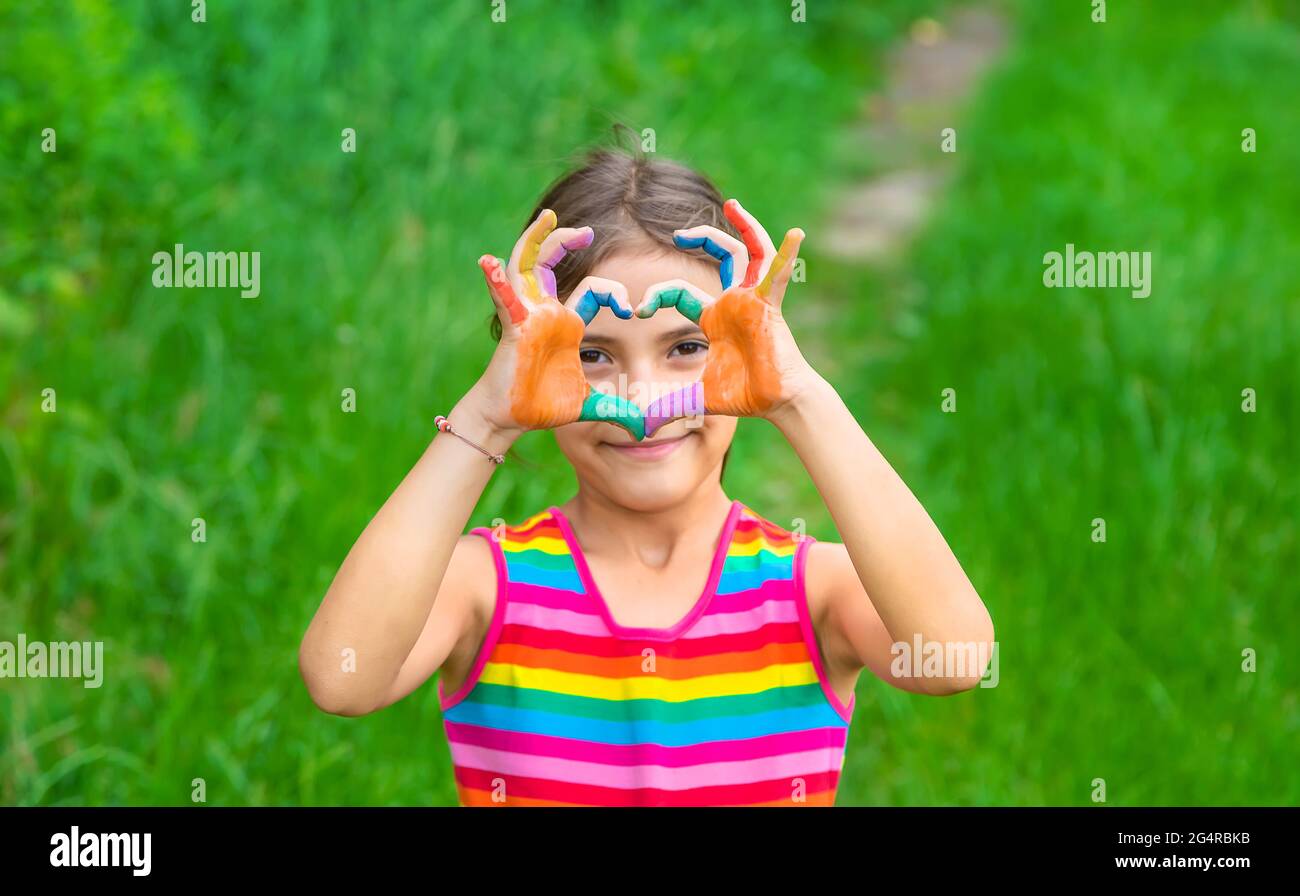 Smile on the hands of a child drawing. Selective focus. Kid Stock Photo ...