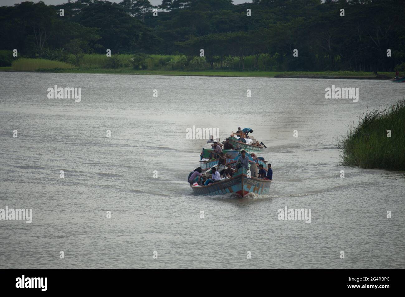The boat is running in the middle of the fast flowing river Stock Photo ...