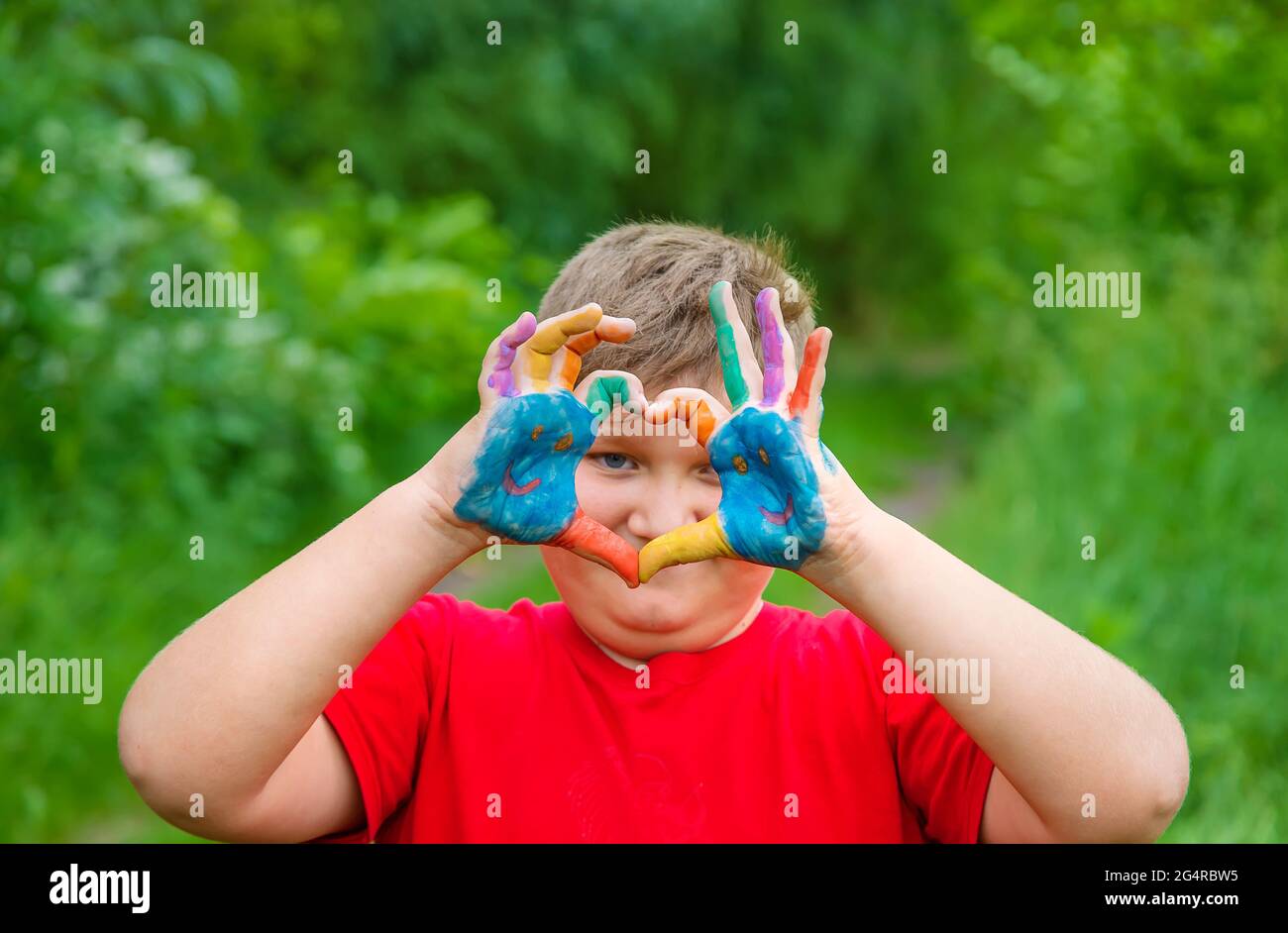 Smile on the hands of a child drawing. Selective focus. Kid Stock Photo ...