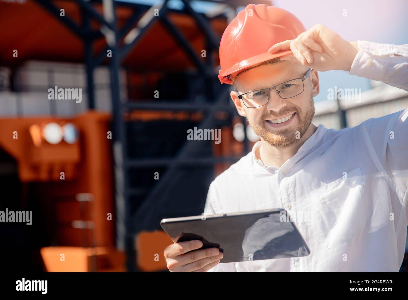 Portret happy worker coal mine in open pit use tablet computer for ...