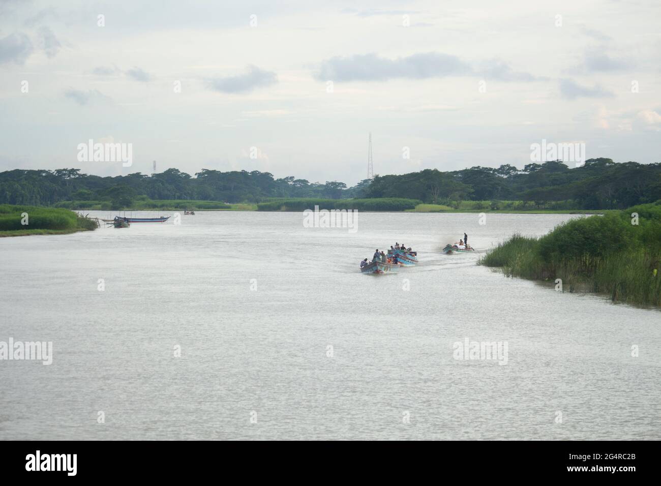 The boat is running in the middle of the fast flowing river Stock Photo ...