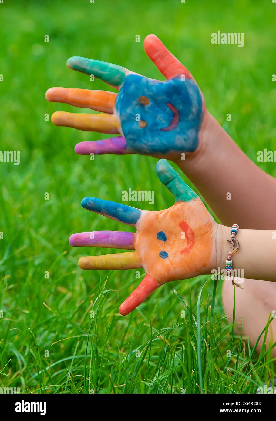 Smile on the hands of a child drawing. Selective focus. Kid Stock Photo ...