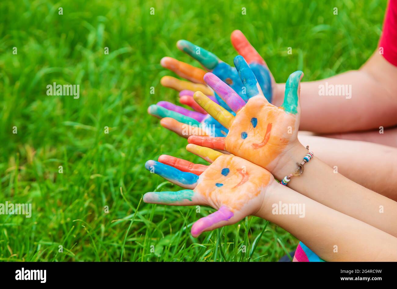 Smile on the hands of a child drawing. Selective focus. Kid Stock Photo ...