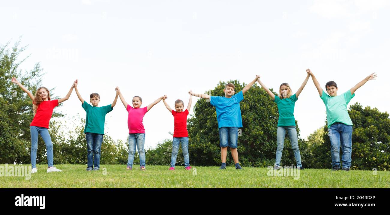 Group of children showing unity outside Stock Photo - Alamy
