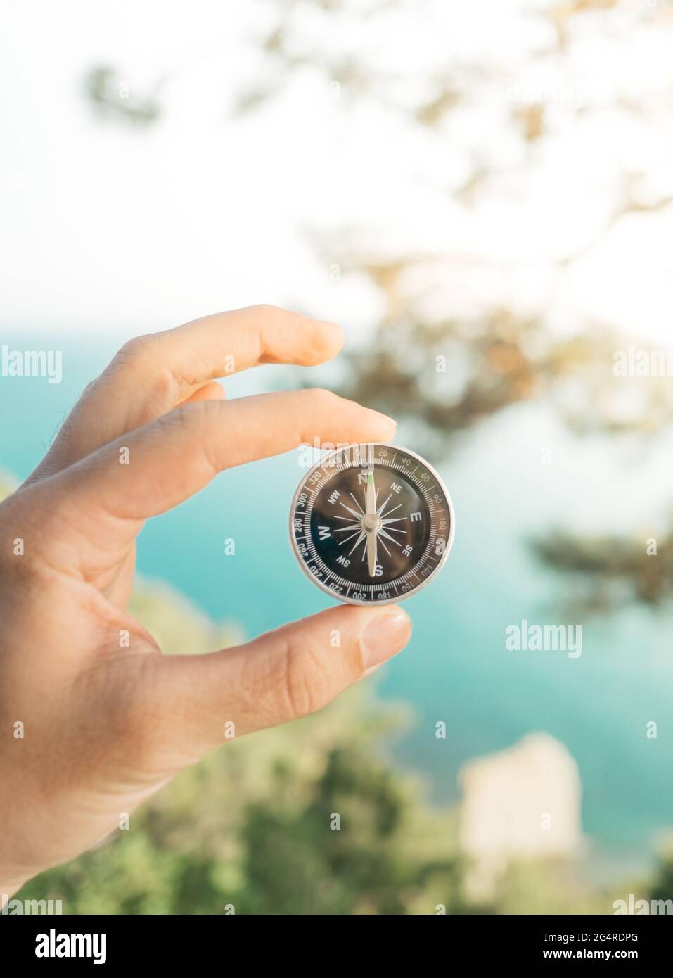 Man hand holding compass hi-res stock photography and images - Alamy