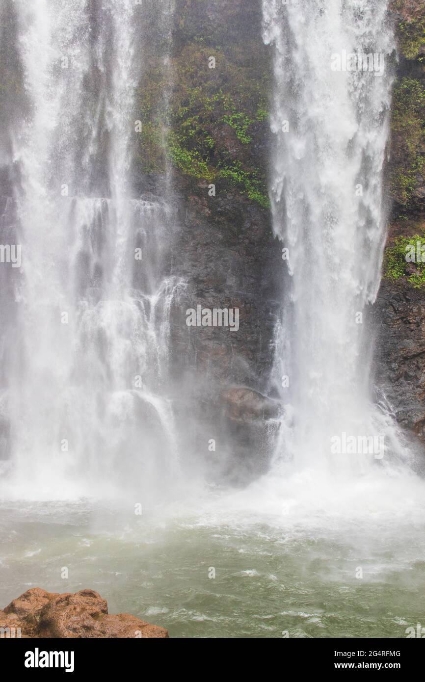 Scenic waterfall in the middle of a forest in Pakse, Laos, Southeast ...