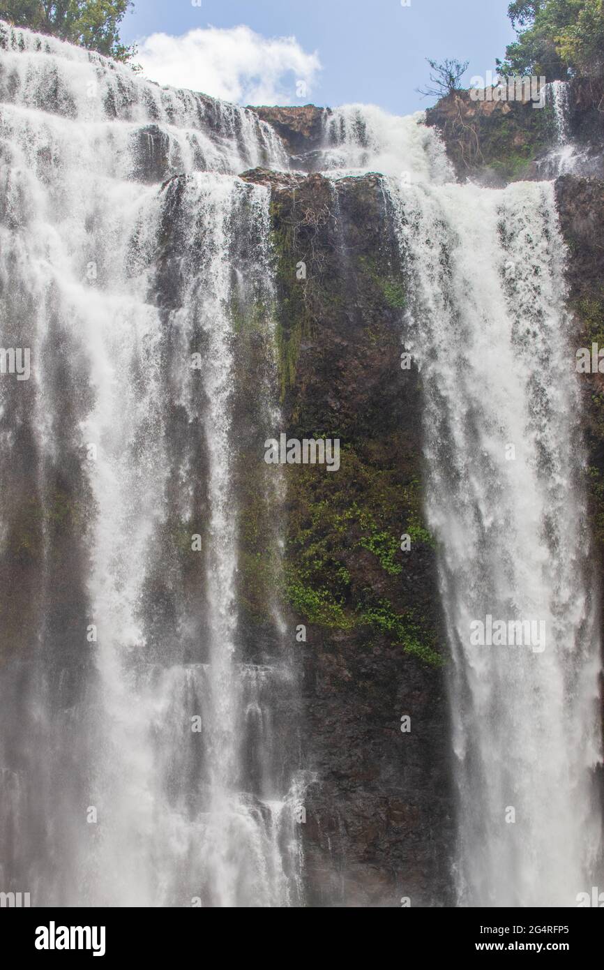 Scenic waterfall in the middle of a forest in Pakse, Laos, Southeast ...