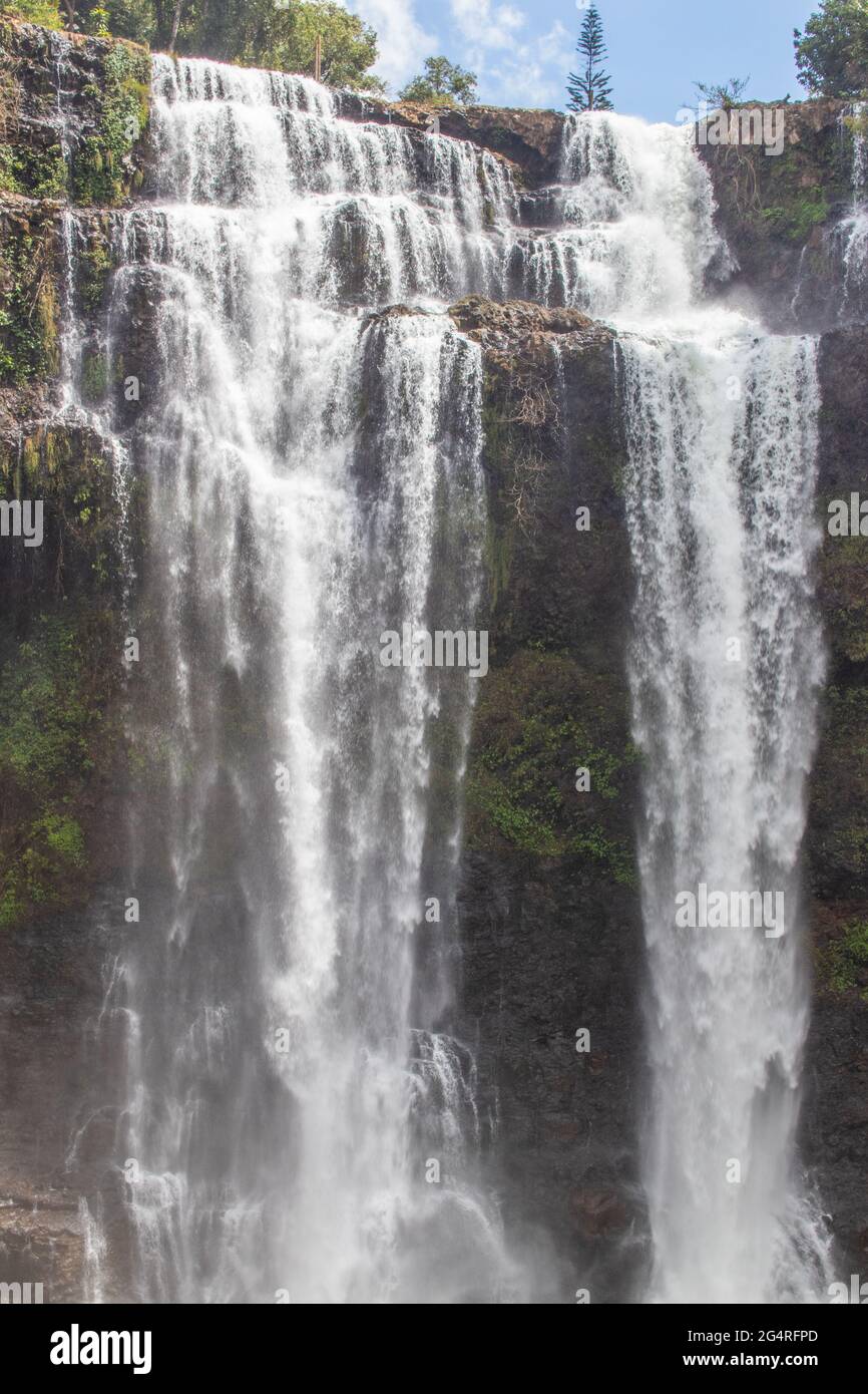 Scenic waterfall in the middle of a forest in Pakse, Laos, Southeast ...