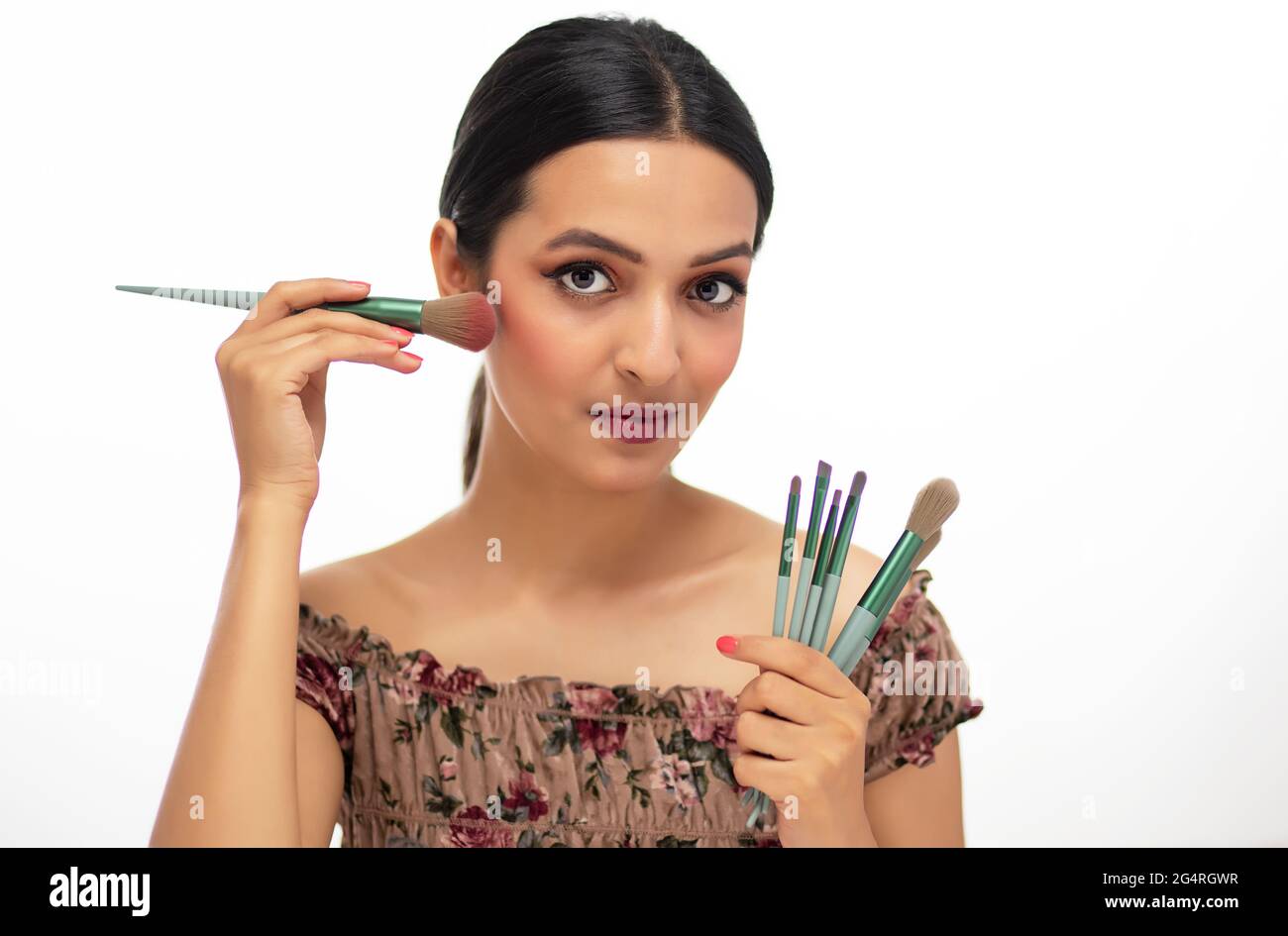 Portrait of beautiful fashion model applying professional makeup Stock ...