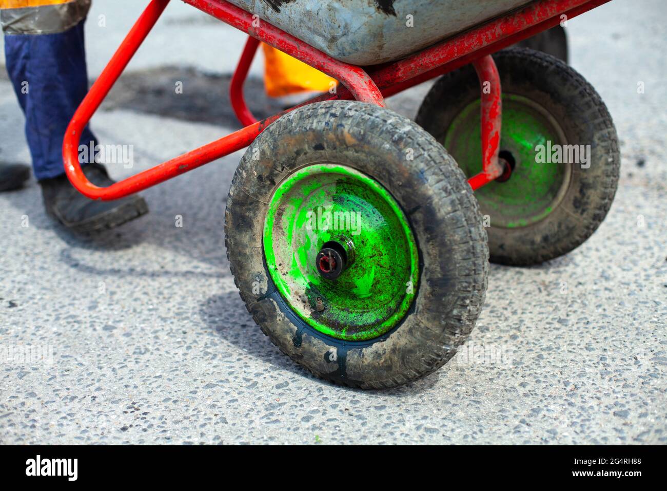 Trolley with asphalt. Road repair. Construction waste trolley. Repair ...
