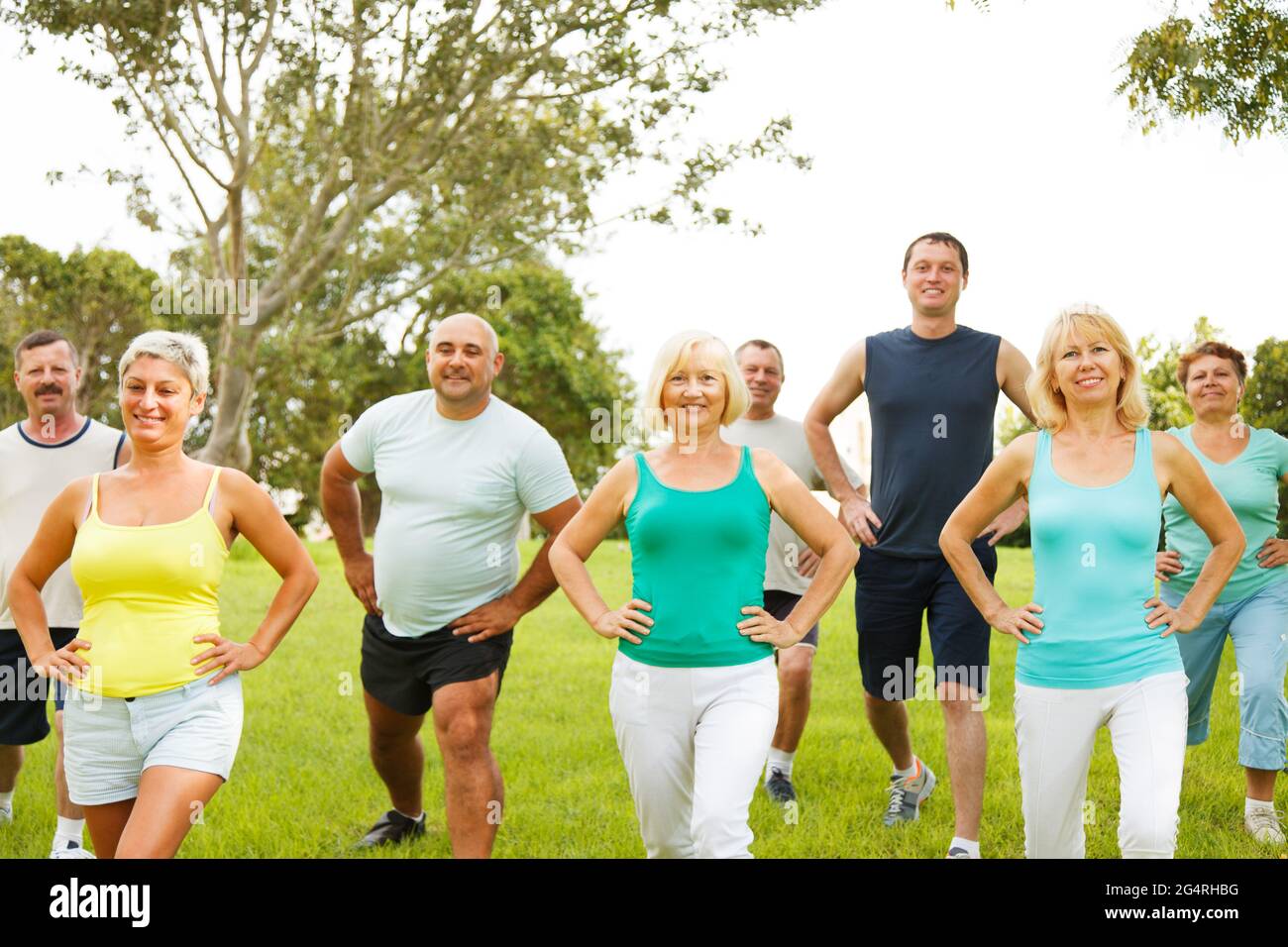 Group of People doing flexibility exercises Stock Photo - Alamy