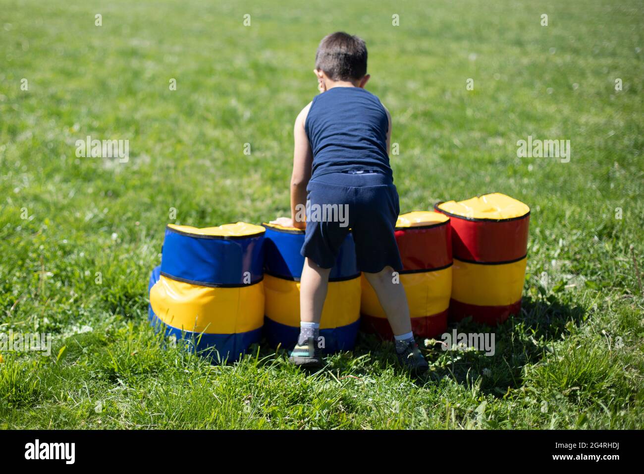 Boy playing on obstacle course hi-res stock photography and images - Alamy