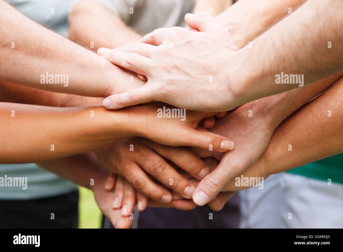 Stack of hands - real people agreement Stock Photo - Alamy