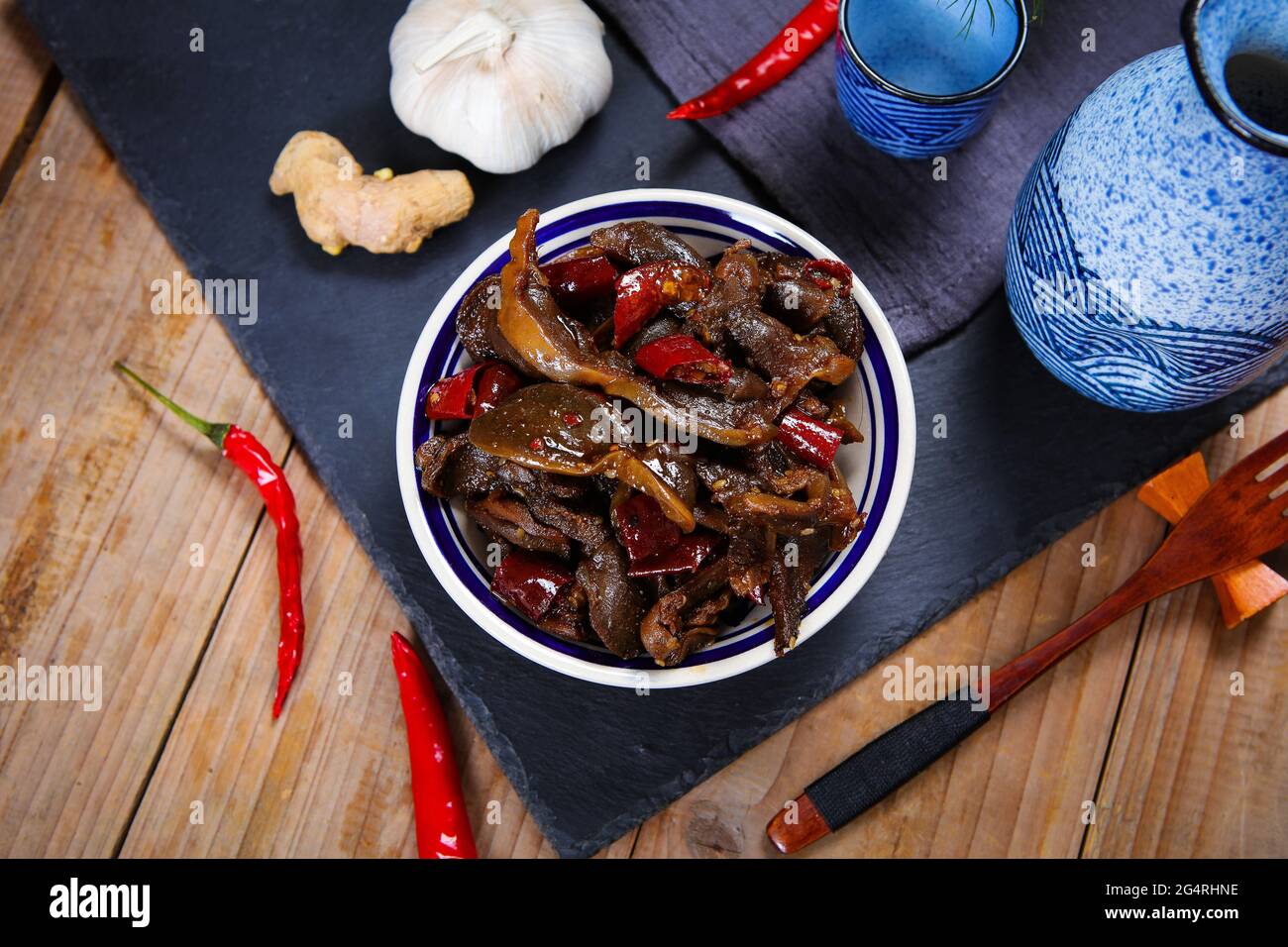 Very spicy chicken gizzard Stock Photo - Alamy