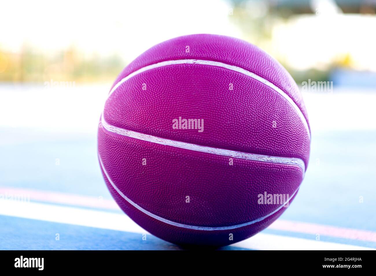 Purple basketball closeup on the playground Stock Photo - Alamy