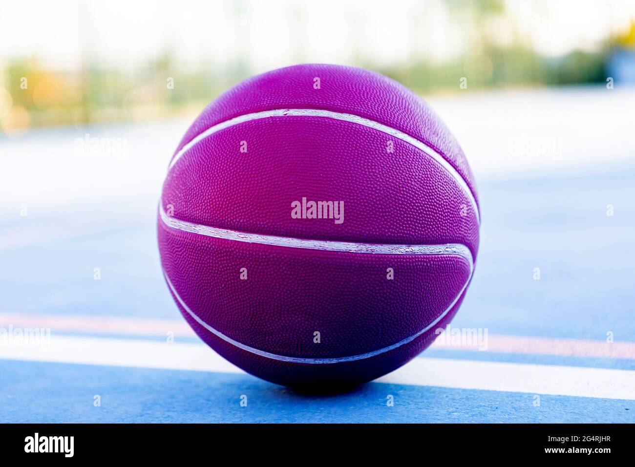 Purple basketball closeup on the playground Stock Photo - Alamy