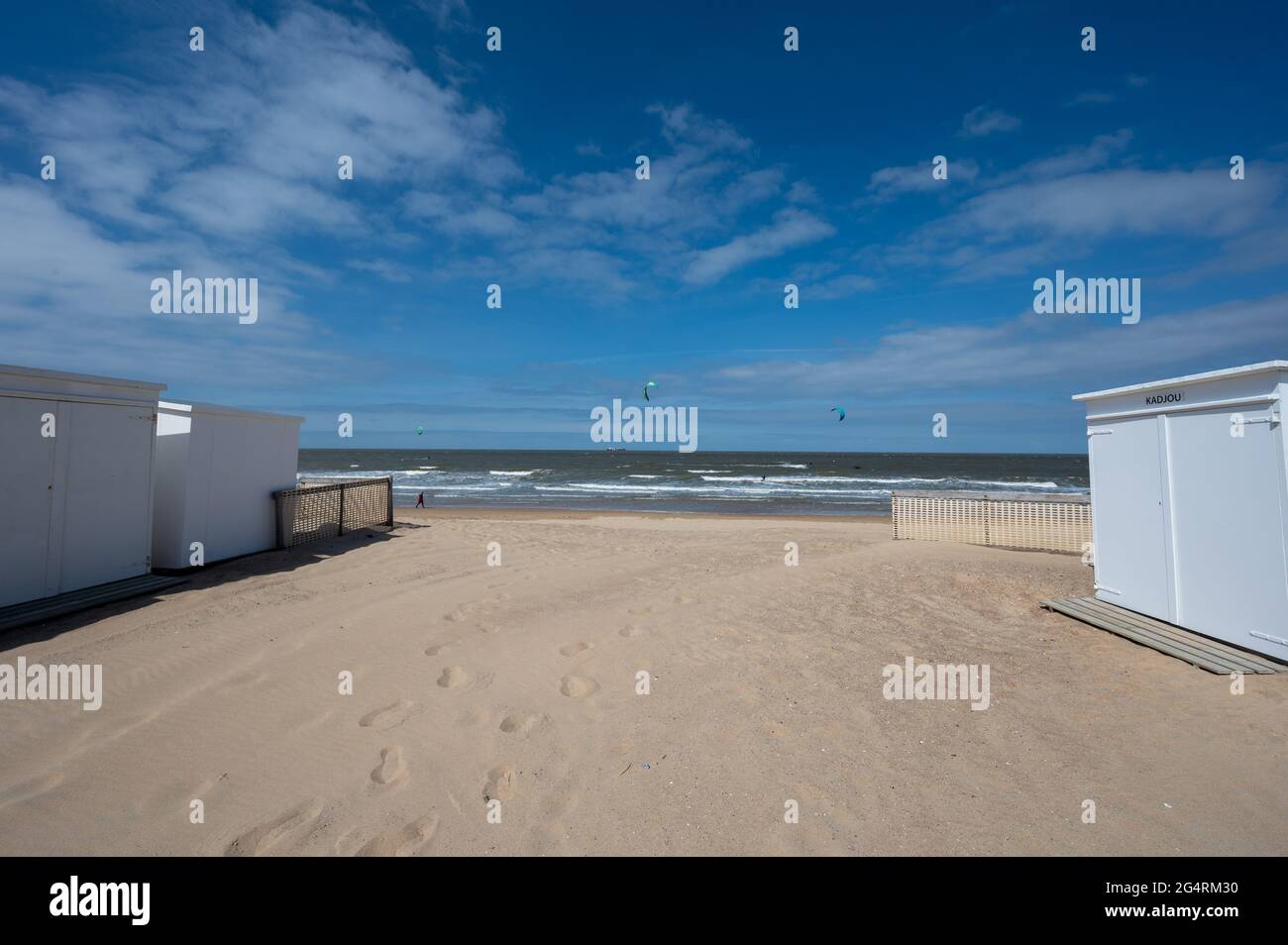 White beach huts on yellow sandy beaches in small Belgian town Knokke ...