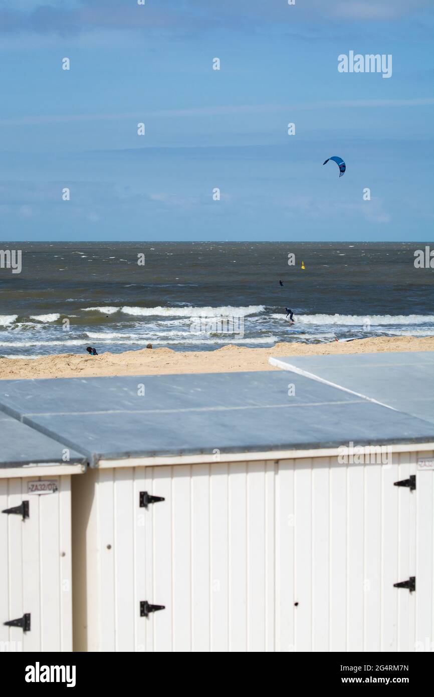 White beach huts on yellow sandy beaches in small Belgian town Knokke ...