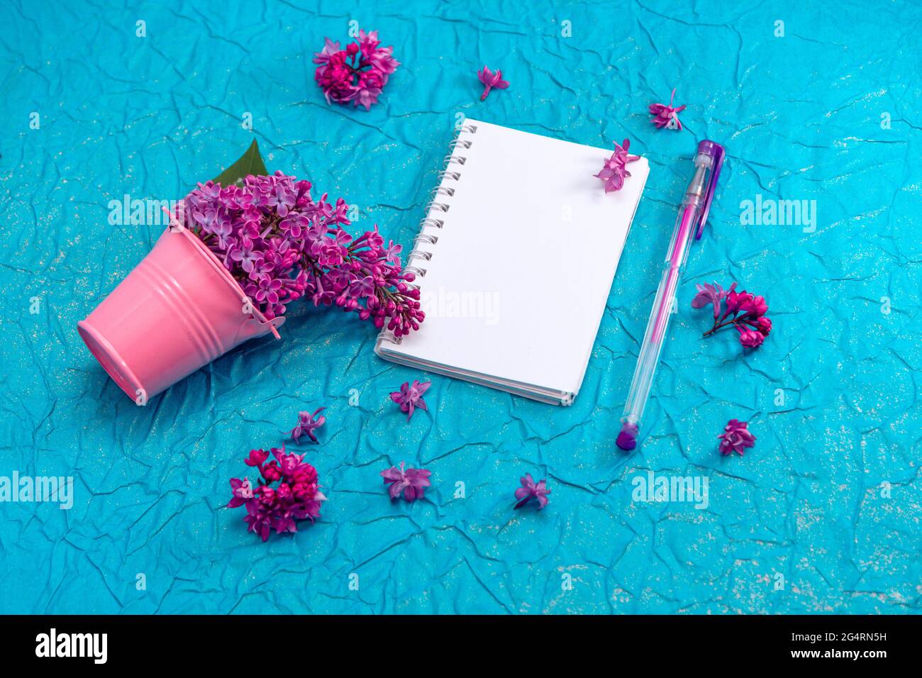 Blank notebook, pen with purple ink and lilac flowers on vintage ...