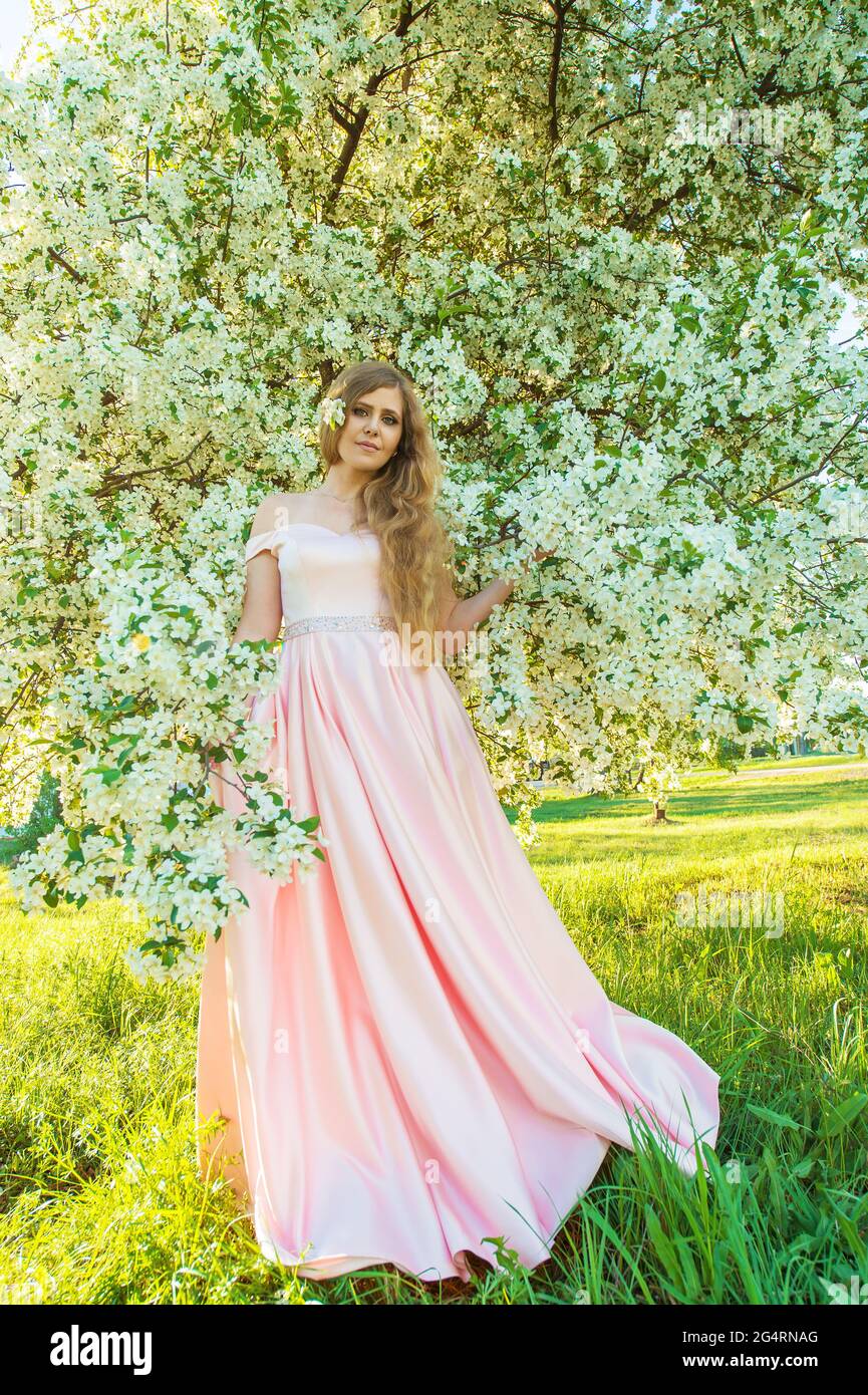 pretty woman in a pink dress Stock Photo - Alamy