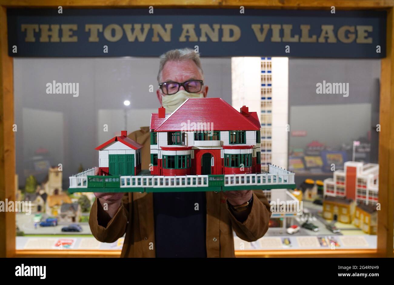 Greg Hoar holds a Bayko model house during a preview for 'Life before ...